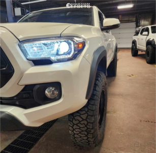 2023 Toyota Tacoma with 17x8.5 0 KMC Km544 and 285/70R17 Maxxis Razr AT ...