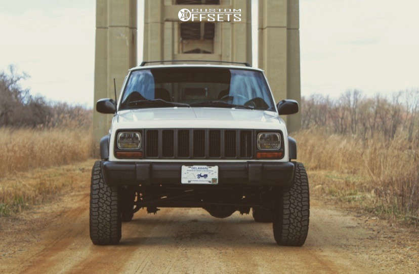 1999 Jeep Cherokee with 15x8 0 US Mags Rambler and 31/10.5R15 Falken ...