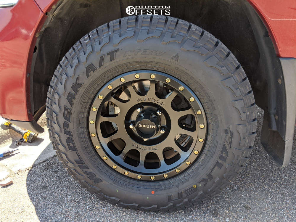 2011 Ram 1500 with 17x8.5 0 Method Nv and 285/70R17 Falken WildPeak ...