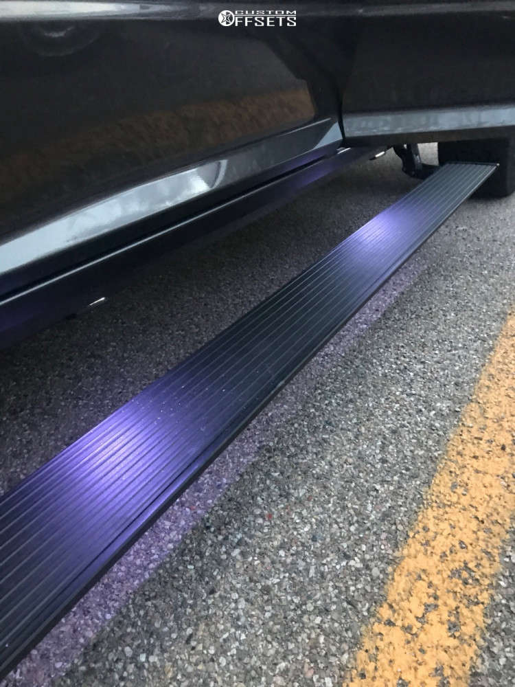 2017 Ram 1500 with 20x10 -24 Method Mr605 and 305/55R20 Falken Wildpeak ...