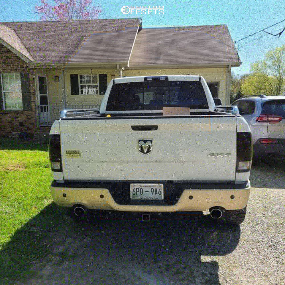 2011 Ram 1500 with 24x12 -44 Vision Rocker and 33/12.5R24 Comforser ...