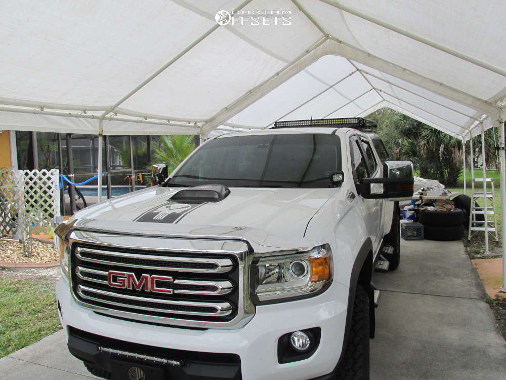 2016 GMC Canyon with 18x9 0 Helo He900 and 265/70R18 General Grabber ...