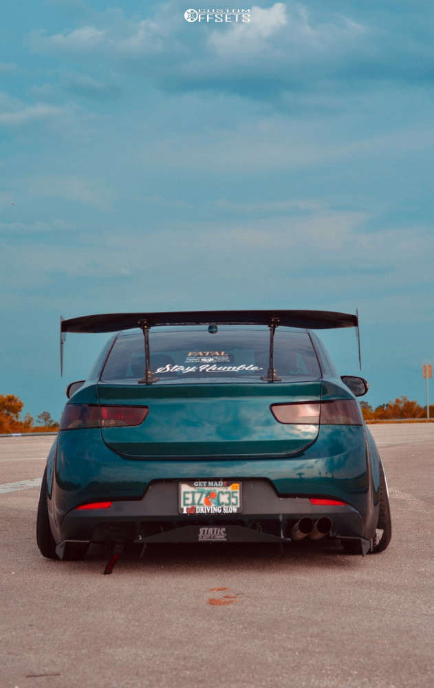 2010 Kia Forte Koup with 17x9.5 35 SSR Sp1 and 205/40R17 Cosmo Mucho ...