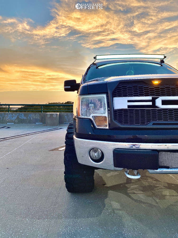 2011 Ford F-150 with 17x9 -12 KMC Monster XD and 35/12.5R17 Nitto Mud ...