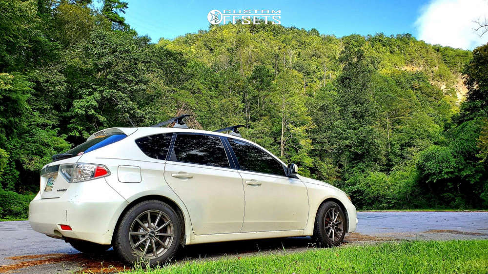 2009 Subaru Impreza with 16x7 48 Moda MD18 and 205/55R16 Yokohama Avid ...