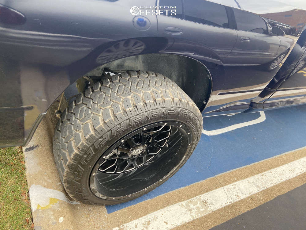 2012 Ram 1500 with 22x12 -44 Xtreme Mudder Xm-328 and 33/12.5R22 Fury ...
