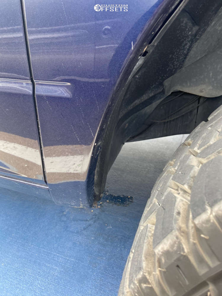 2012 Ram 1500 with 22x12 -44 Xtreme Mudder Xm-328 and 33/12.5R22 Fury ...