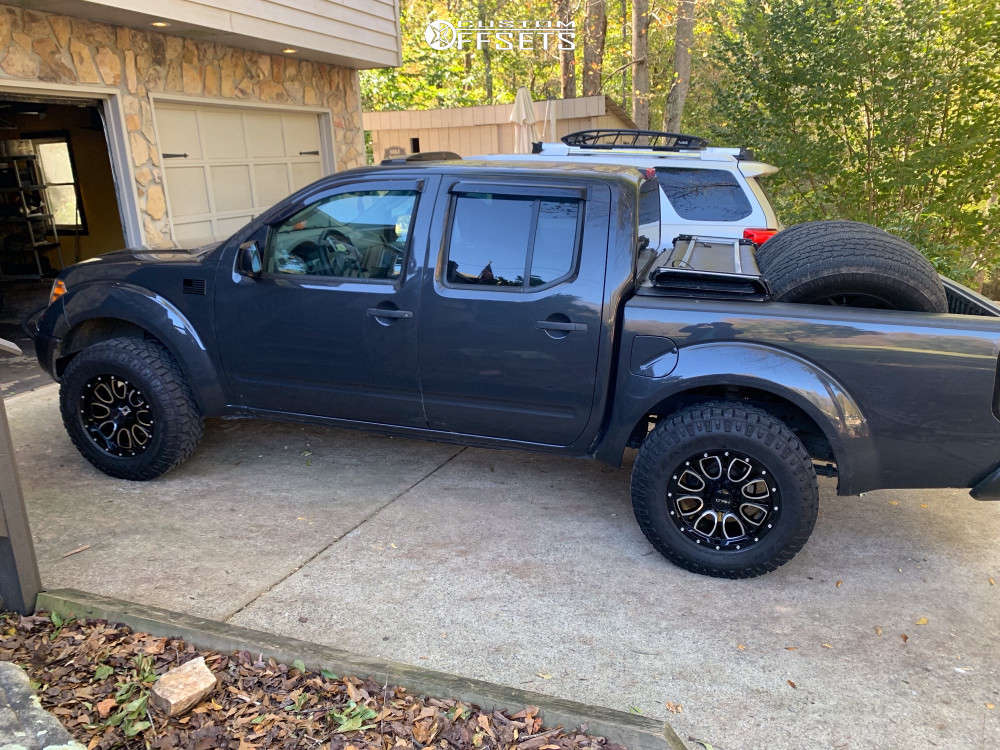 2010 Nissan Frontier with 17x9 18 Helo He879 and 32/9.5R17 Goodyear ...