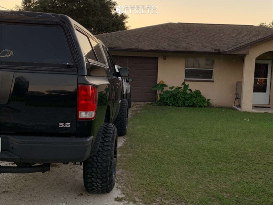 2004 Nissan Titan with 20x12 -51 Vision Prowler and 35/12.5R20 Kanati ...