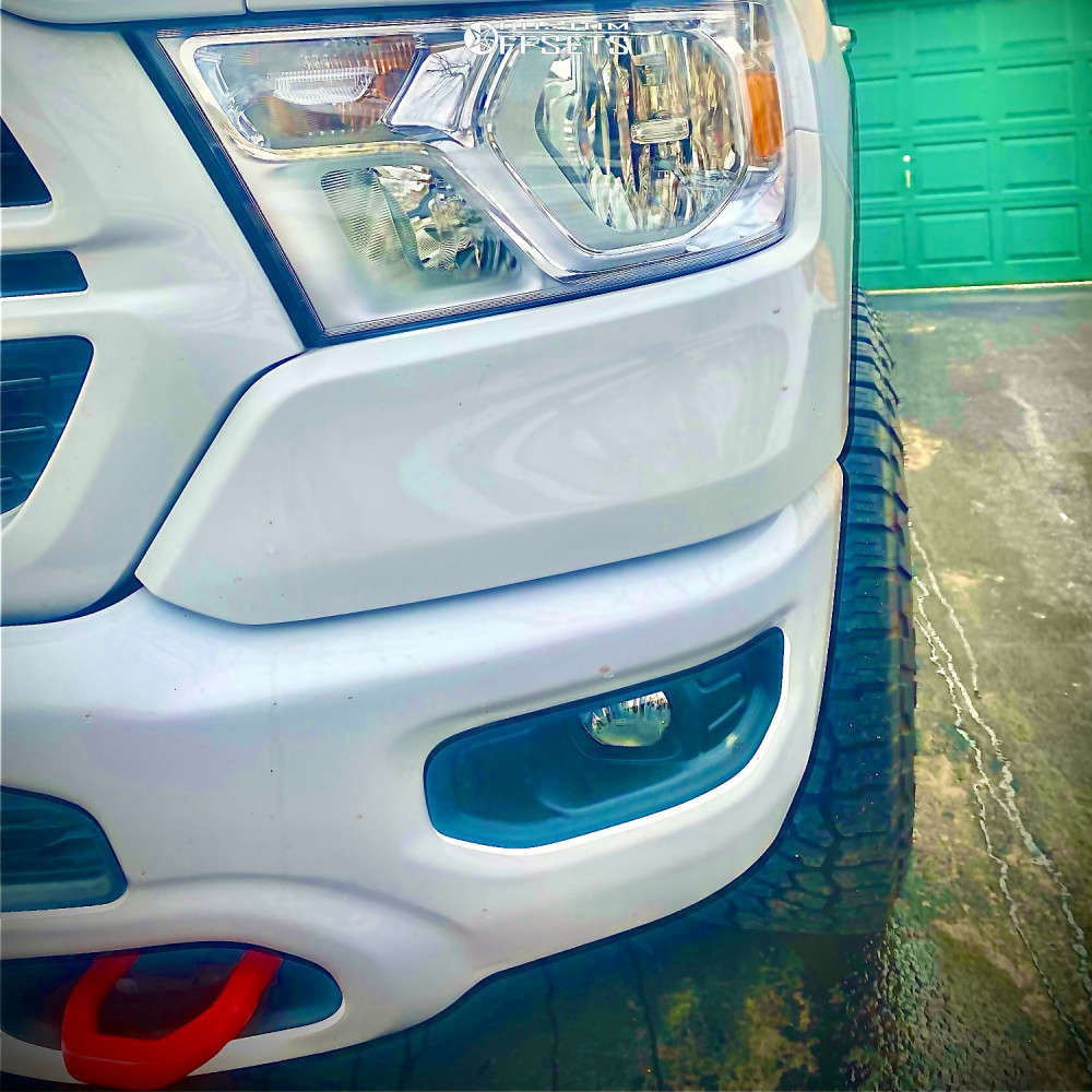 2019 Ram 1500 with 18x9 -12 Vision Split and 275/70R18 Falken WildPeak ...