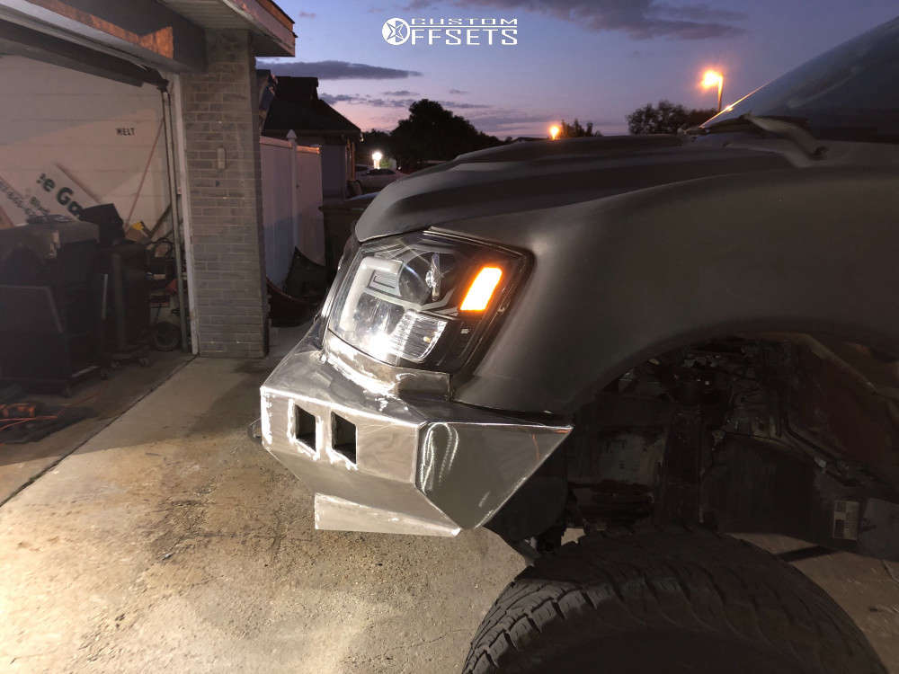 2009 Nissan Titan with 18x10 -24 Ballistic Scythe and 35/12.5R18 ...