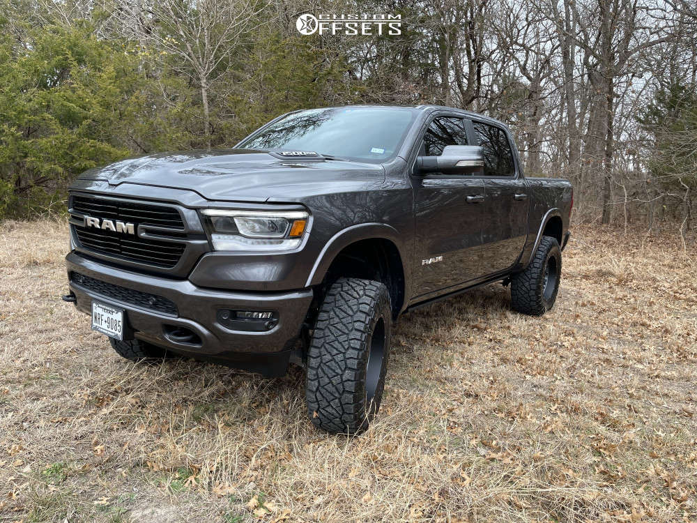 2020 Ram 1500 with 20x10 -24 Vision Rocker and 37/12.5R20 Nitto Ridge ...