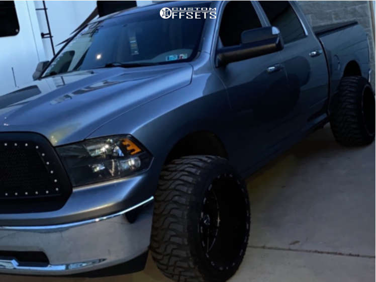 2011 Ram 1500 with 22x14 -76 TIS 544BM and 33/12.5R22 Federal Couragia ...