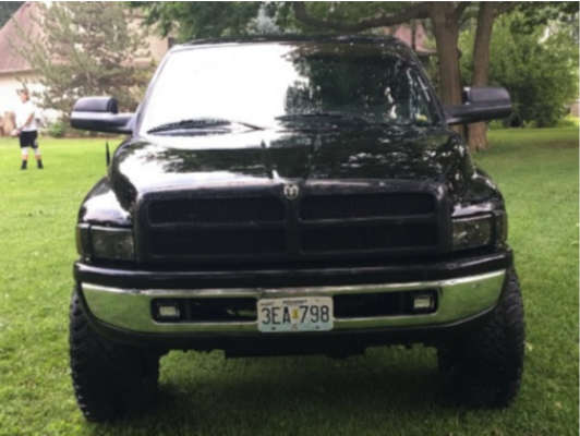 1995 Dodge Ram 1500 with 17x10 -24 Moto Metal 962 and 35/12.5R17 Atturo ...