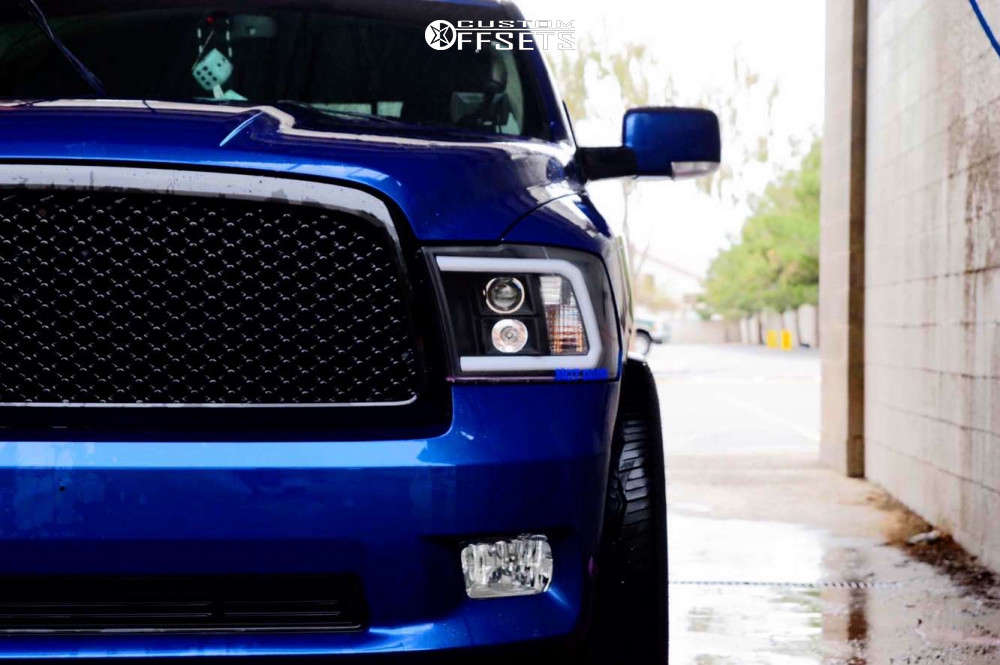 2011 Ram 1500 with 20x10 -25 Vision Razor and 305/50R20 Nitto NT420V ...