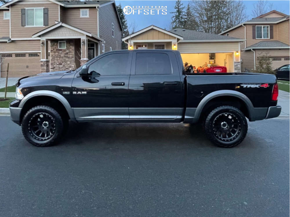 2010 Dodge Ram 1500 with 20x10 -24 Method Nv and 305/55R20 Falken ...