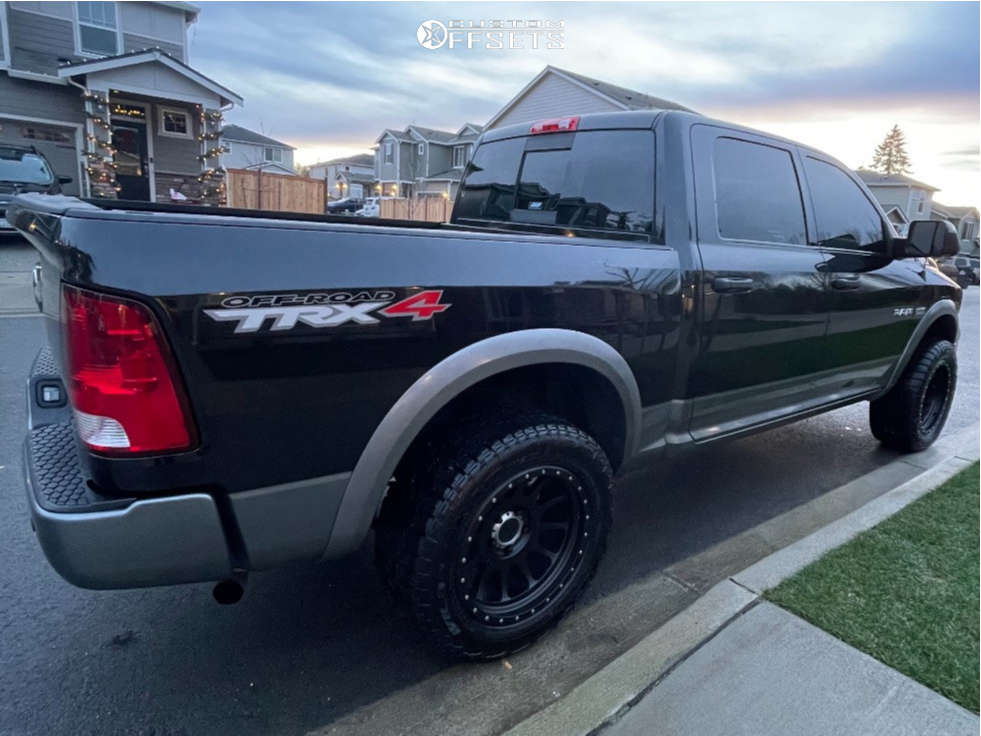 2010 Dodge Ram 1500 with 20x10 -24 Method Nv and 305/55R20 Falken ...