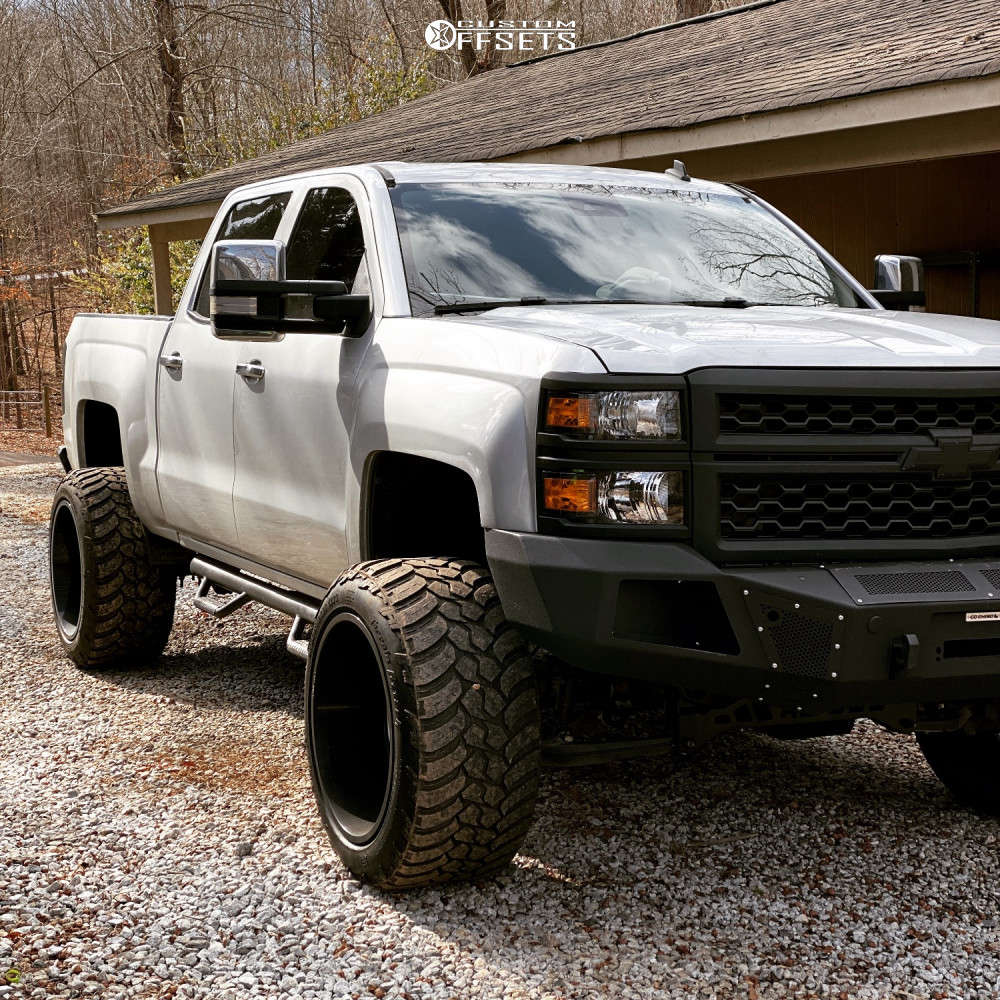 2014 Chevrolet Silverado 1500 with 22x14 -83 Hostile Jigsaw H116 and 35/14.5R22 AMP Mud Terrain ...