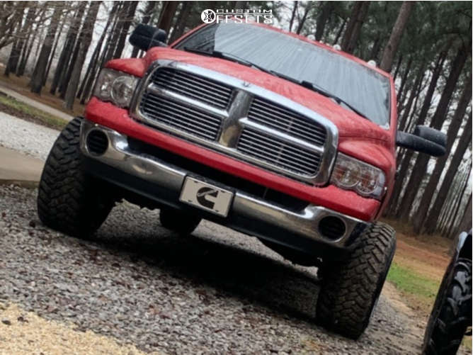 2005 Dodge Ram 3500 with 22x14 -77 TIS 544BM and 33/12.5R22 Nitto Trail ...