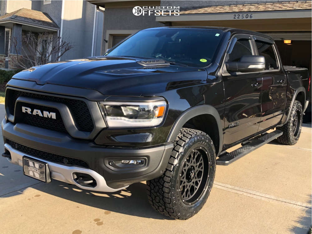2020 Ram 1500 with 20x10 -24 Vision Rocker and 33/12.5R20 Nitto Open ...