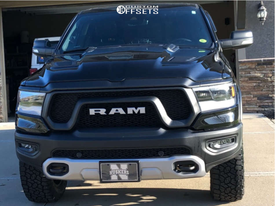 2020 Ram 1500 with 20x10 -24 Vision Rocker and 33/12.5R20 Nitto Open ...