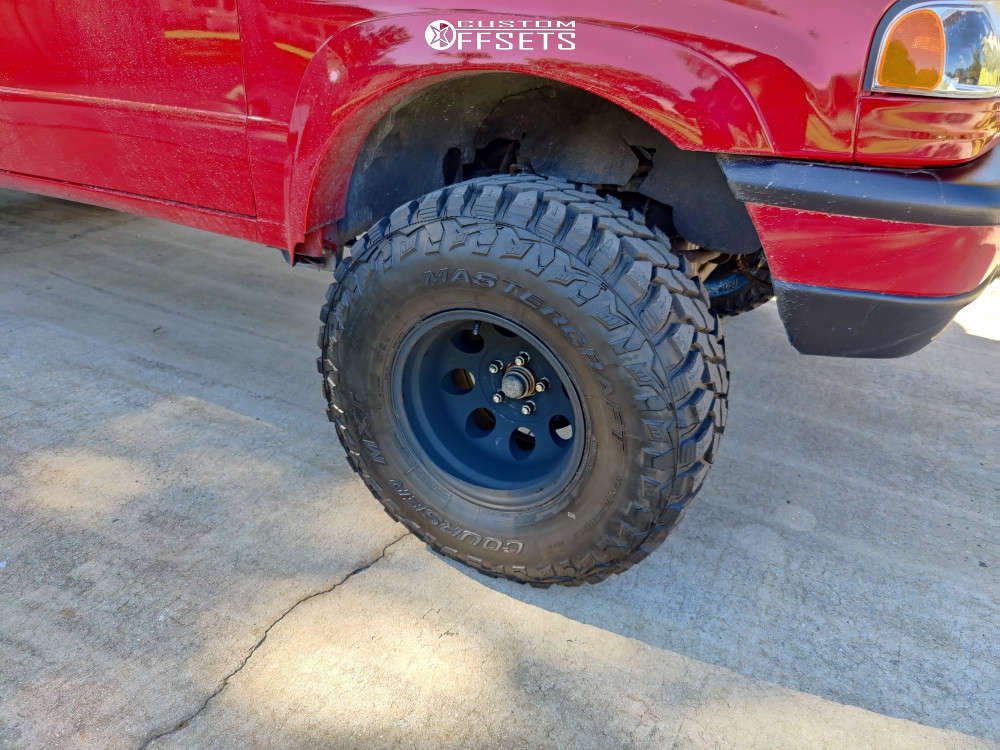 2001 Mazda B3000 with 15x10 -47 Pro Comp 69 and 33/12.5R15 Mastercraft ...