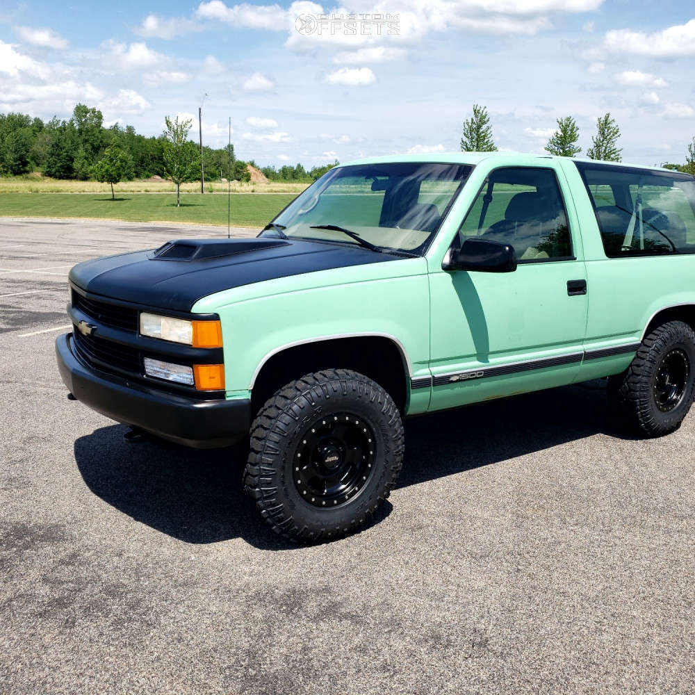 1997 Chevrolet Tahoe with 16x8 AMR AR969 and 285/75R16 Goodyear ...