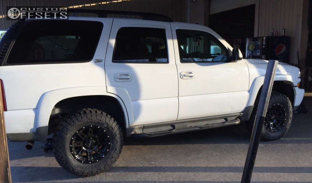 2003 Chevrolet Tahoe with 20x9 0 Helo He900 and 33/12.5R20 Continental ...