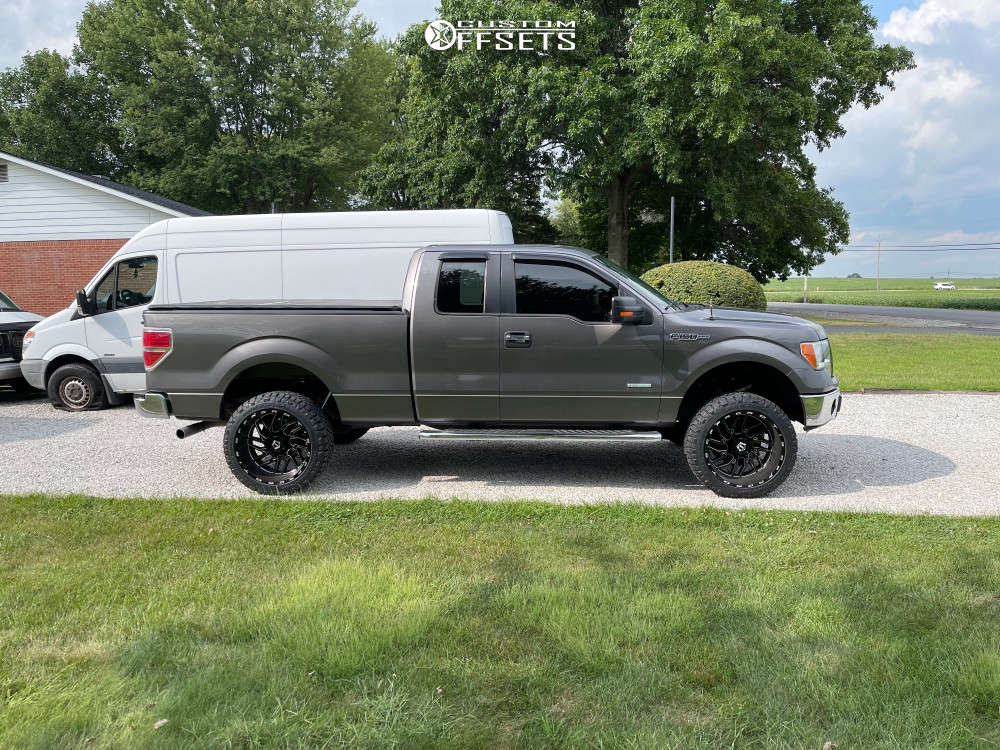 2011 Ford F-150 with 22x12 -44 TIS 544BM and 33/12.5R22 Nitto Ridge ...