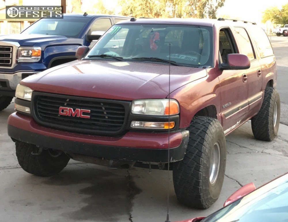 2004 GMC Yukon XL 1500 with 15x10 -38 American Racing Outlaw Ii and 35/ ...