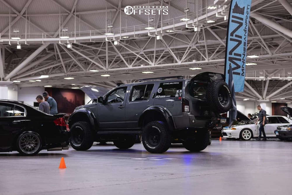 2009 Nissan Pathfinder with 16x8 12 American Racing Baja and 315/75R16 ...