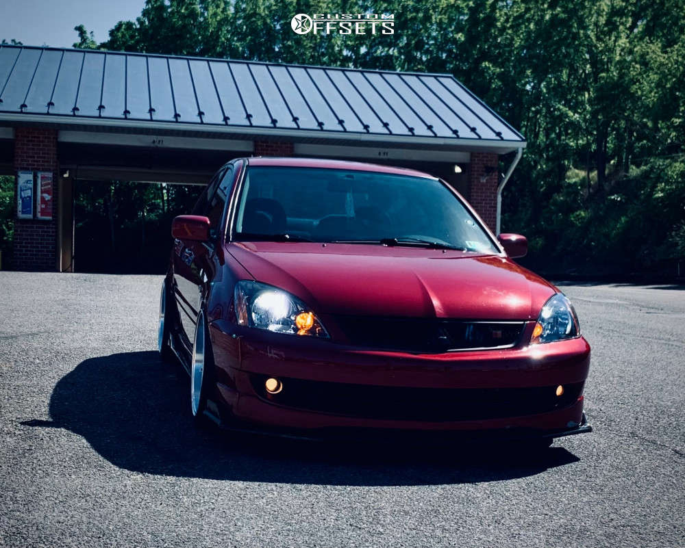 2006 Mitsubishi Lancer with 18x9.5 22 ESR Cs15 and 215/40R18 Lionhart ...