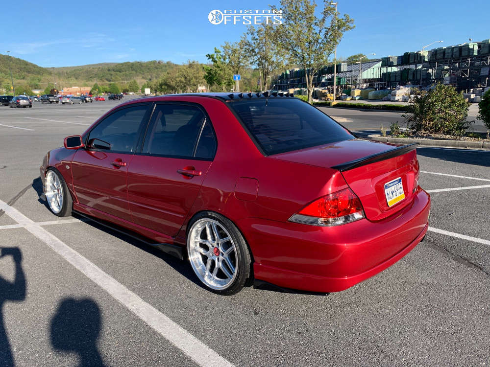 2006 Mitsubishi Lancer with 18x9.5 22 ESR Cs15 and 215/40R18 Lionhart ...