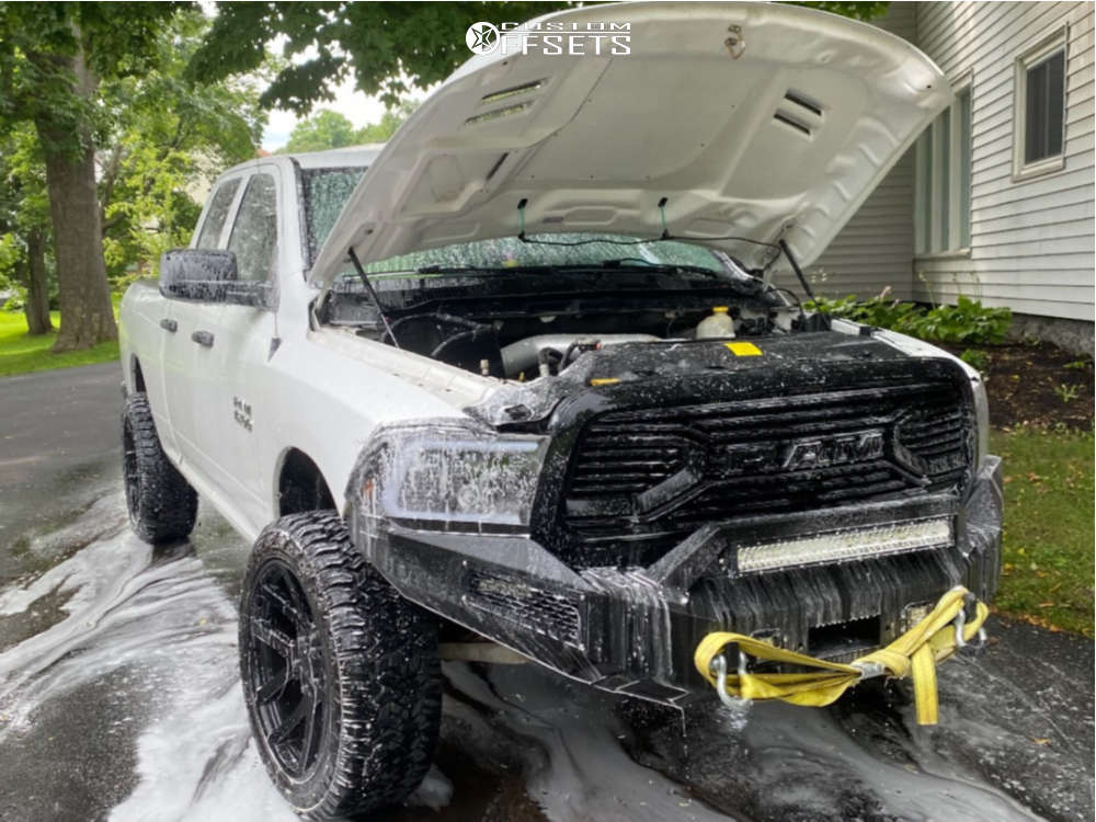 2015 Ram 1500 with 22x12 -44 American Outlaw 12 Gauge and 25/12.5R22 ...