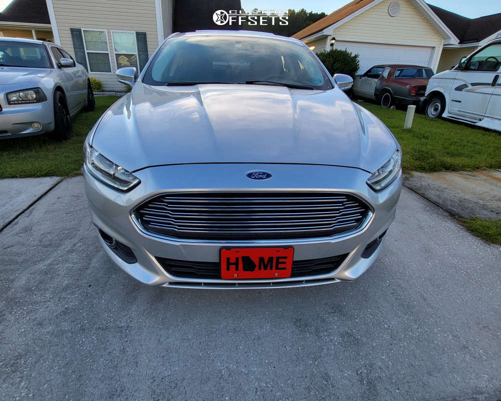 2013 Ford Fusion with 20x8.5 38 Ravetti M11 and 245/35R20 Falken Ziex ...