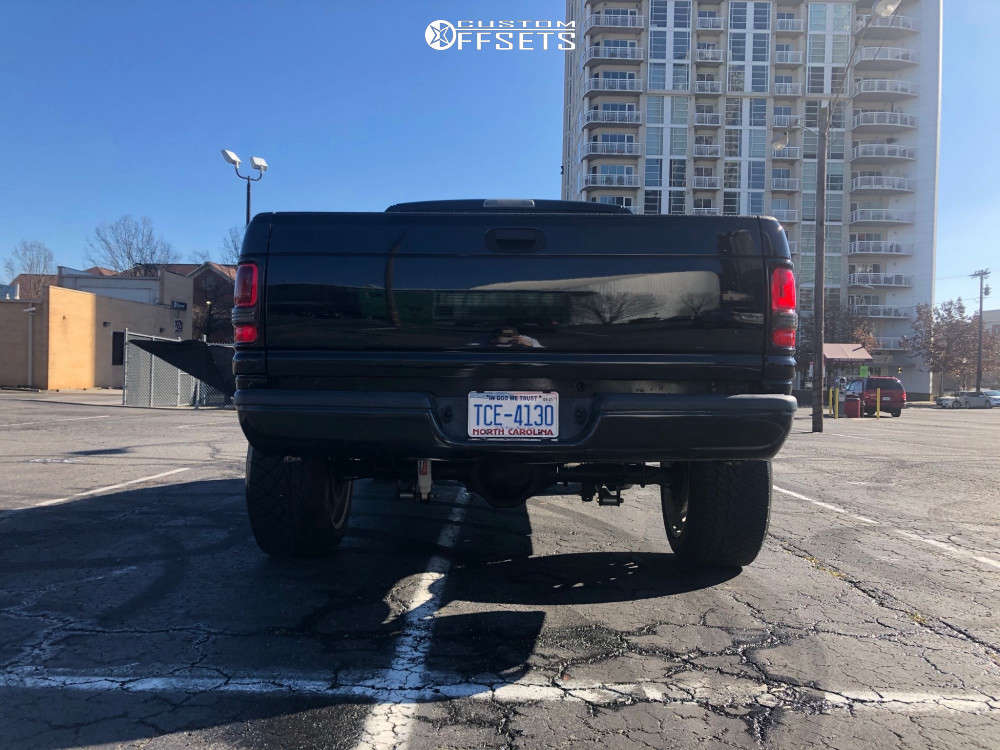 2001 Dodge Ram 1500 with 20x12 -44 V-Rock Anvil and 305/50R20 Nitto ...