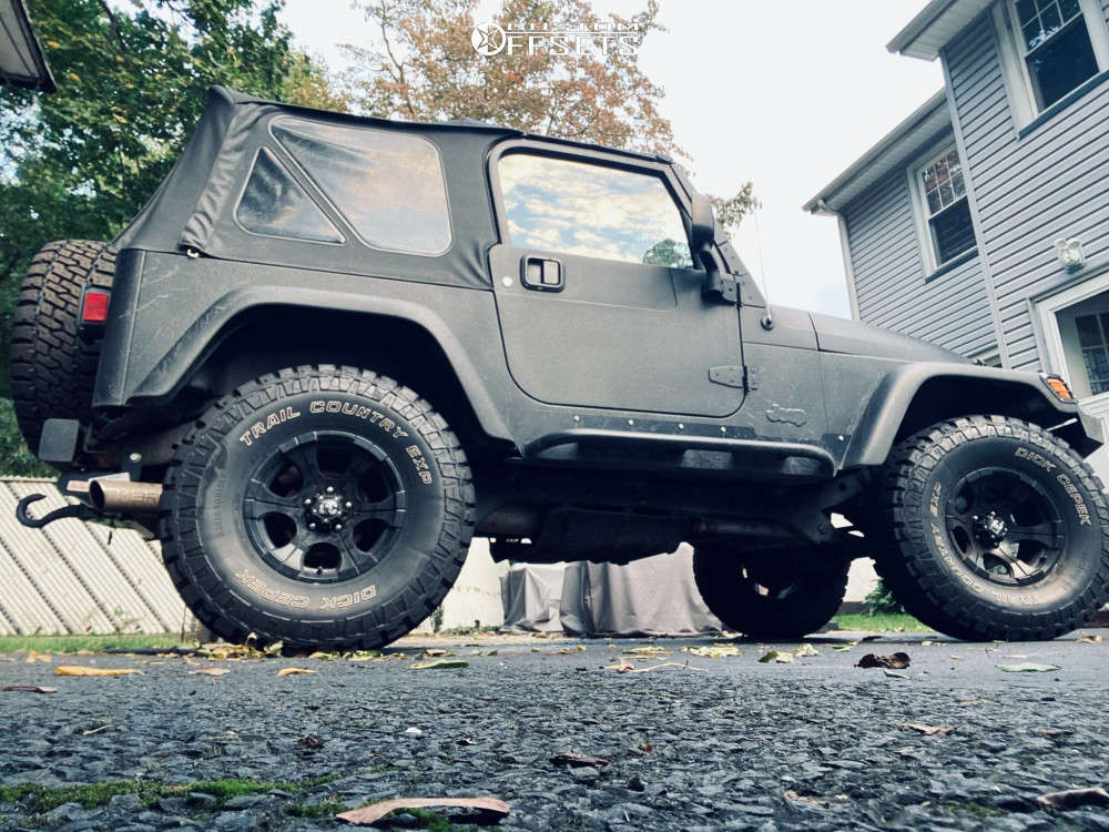 2006 Jeep TJ with 15x8 -13 Dick Cepek Dc-2 and 33/12.5R15 Dick Cepek ...