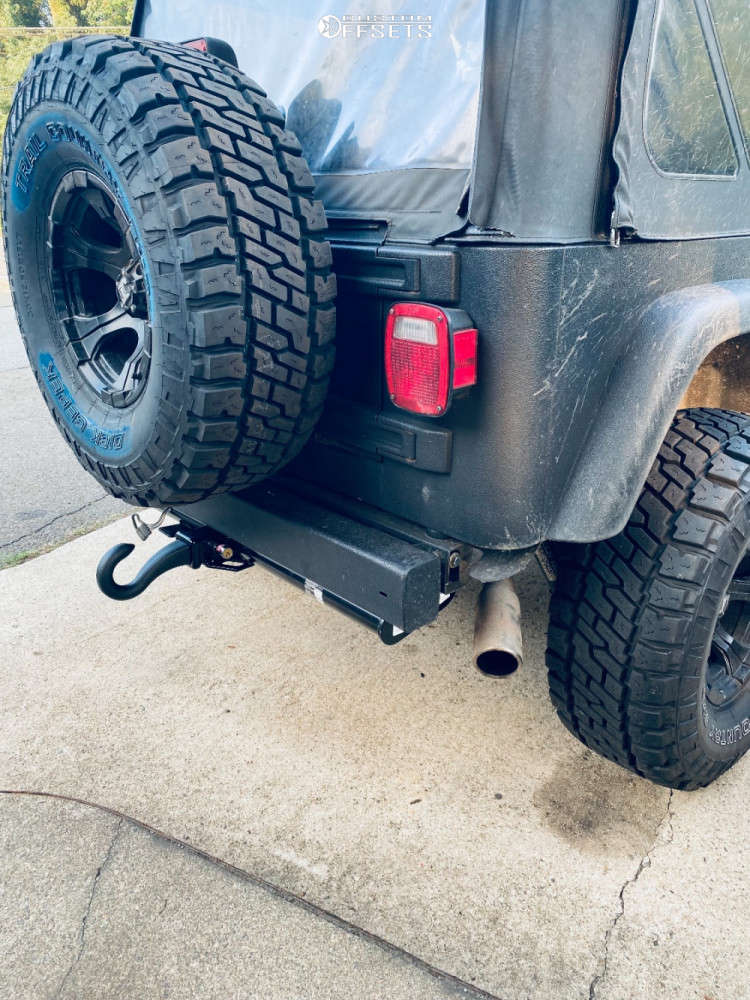 2006 Jeep TJ with 15x8 -13 Dick Cepek Dc-2 and 33/12.5R15 Dick Cepek ...