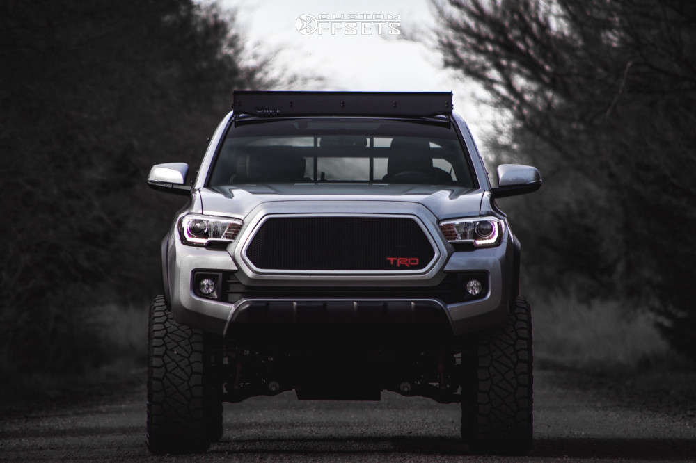 2017 Toyota Tacoma with 20x9 -24 Helo He900 and 35/12.5R20 Nitto Trail ...