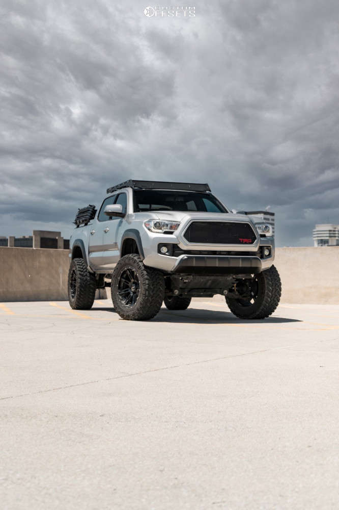 2017 Toyota Tacoma with 20x9 -24 Helo He900 and 35/12.5R20 Nitto Trail ...