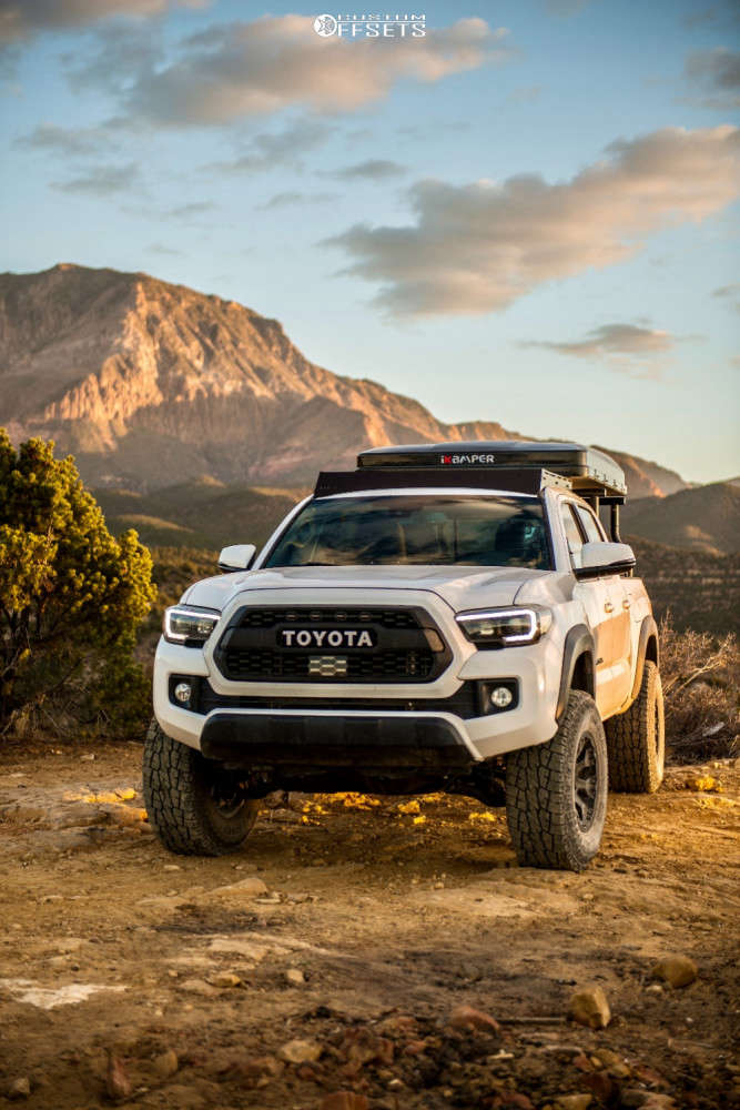 2019 Toyota Tacoma with 16x9 -12 Helo He835 and 285/11.5R16 Pro Comp A ...