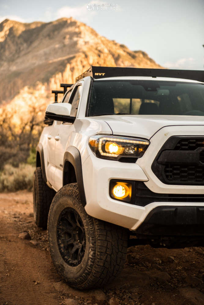 2019 Toyota Tacoma with 16x9 -12 Helo He835 and 285/11.5R16 Pro Comp A ...