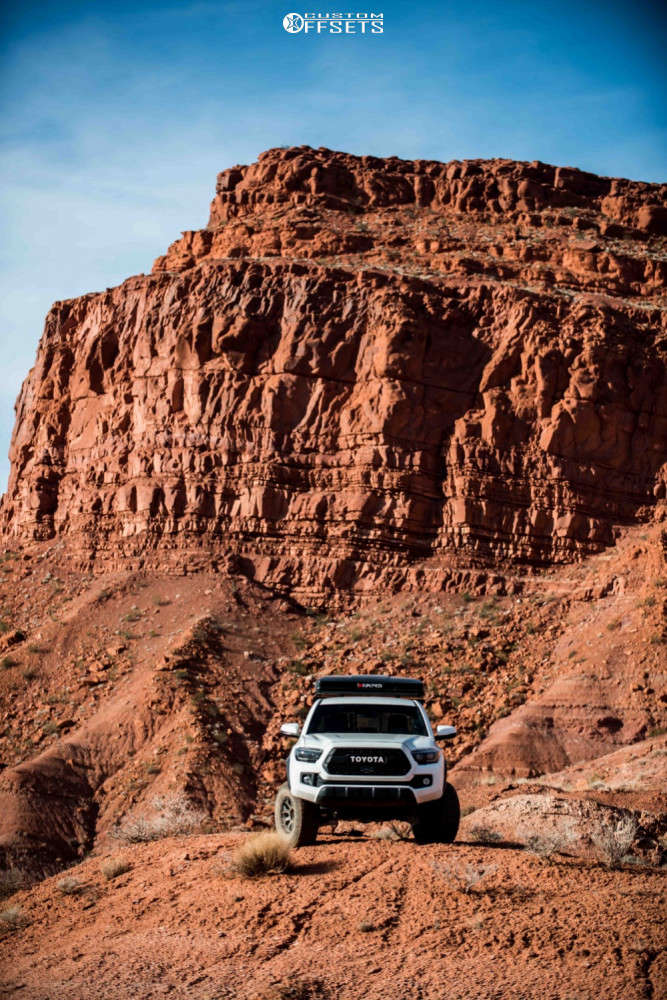 2019 Toyota Tacoma with 16x9 -12 Helo He835 and 285/11.5R16 Pro Comp A ...