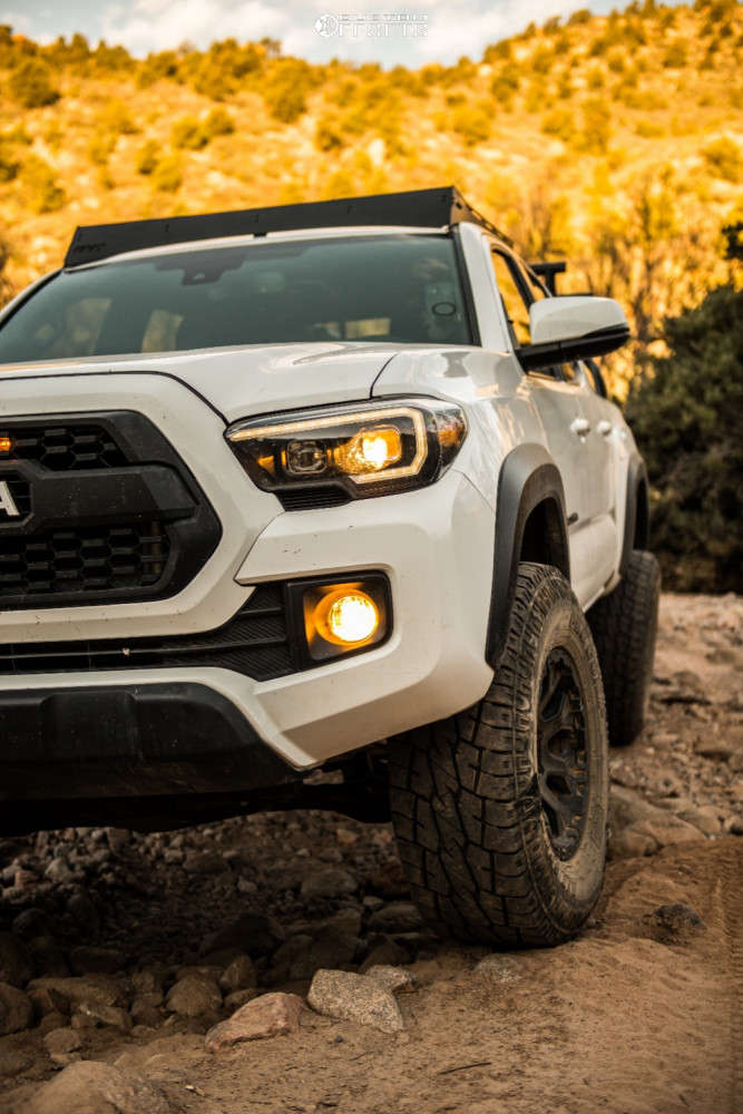 2019 Toyota Tacoma with 16x9 -12 Helo He835 and 285/11.5R16 Pro Comp A ...