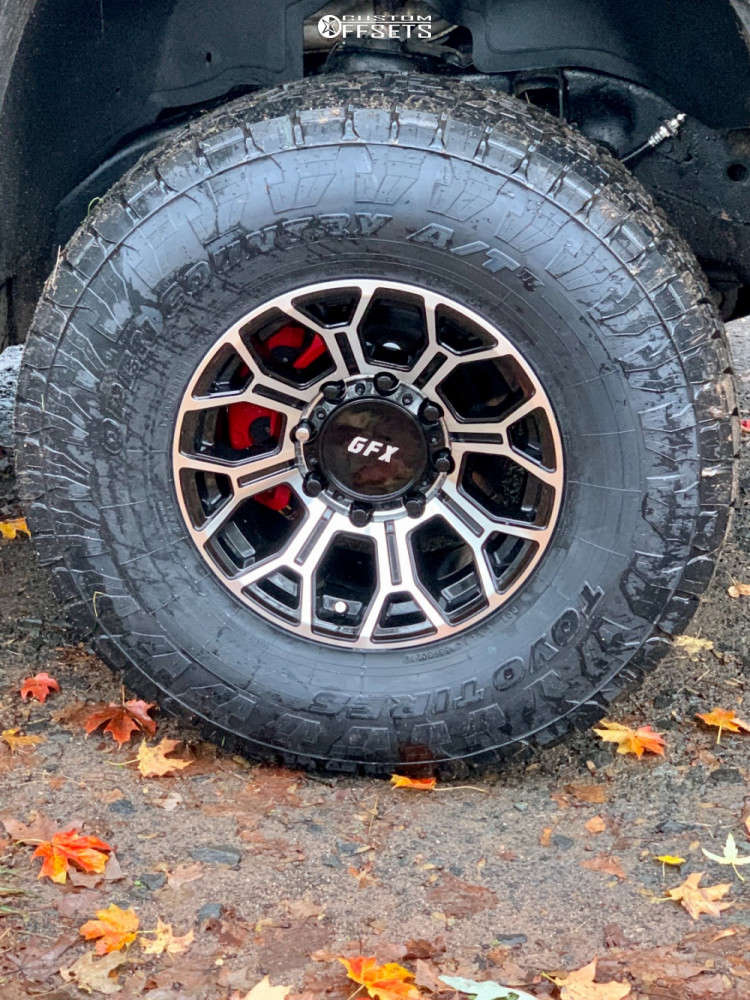 2002 GMC Sierra 2500 HD with 16x8.5 -12 G-FX Tr19 and 285/75R16 Toyo ...