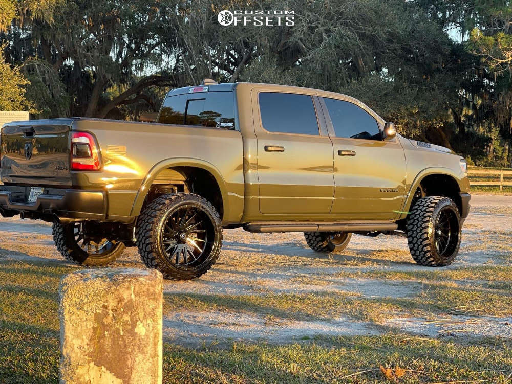 2021 Ram 1500 with 24x12 -44 TIS 547B and 35/12.5R24 Versatyre Mt and ...
