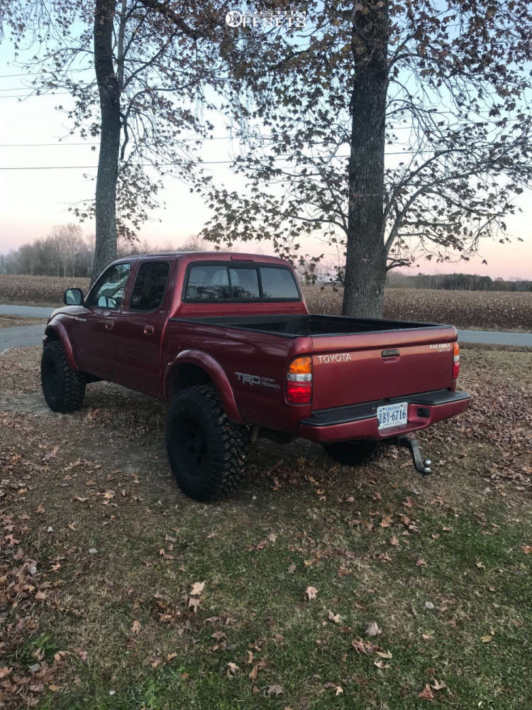 2002 Toyota Tacoma with 16x8 -12 Pro Comp 7069 and 33/11.5R16 Maxxis ...