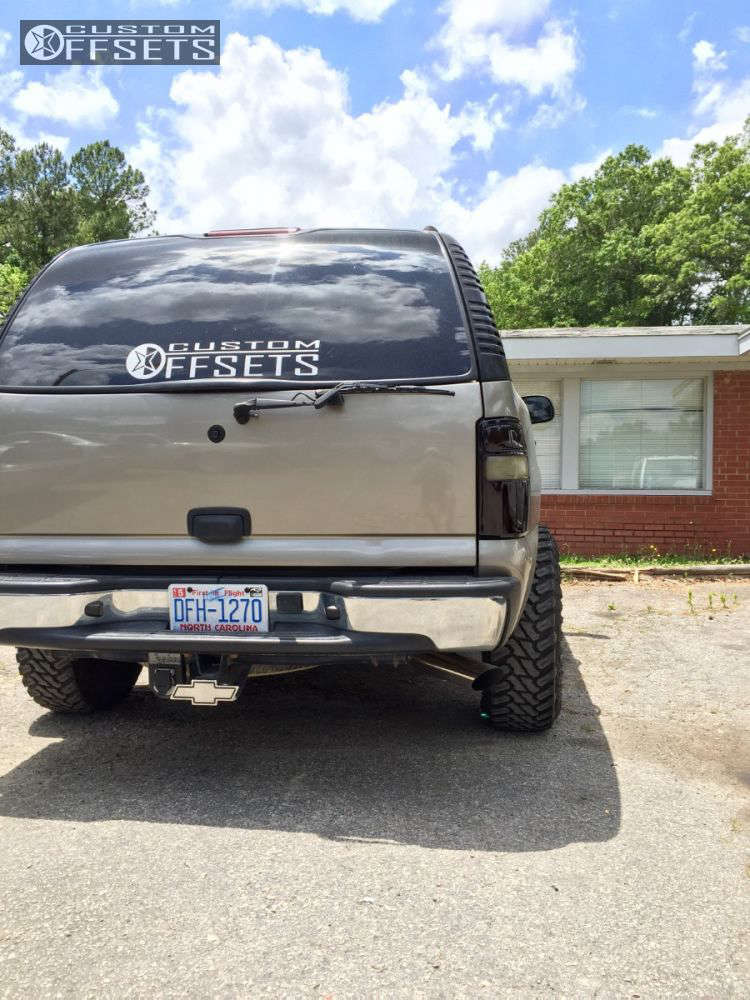 2003 Chevrolet Tahoe with 16x9 -12 Helo HE878 and 285/75R16 Atturo ...