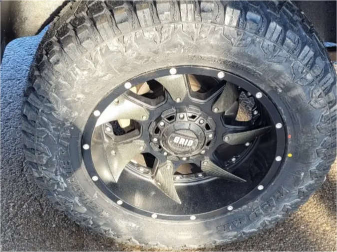 2015 Ram 1500 with 20x10 -18 Grid Gd01 and 35/12.5R20 Radar Renegade Rt ...