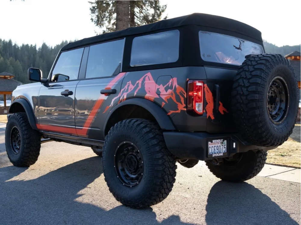 2021 Ford Bronco with 17x8.5 American Outlaw Dusty Road and 37/12.5R17 Nexen Roadian Mtx and ...